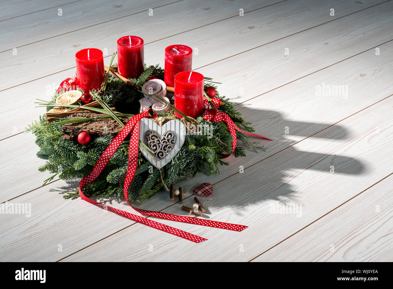 Advent wreath of twigs with red candles and various ornaments Stock ...
