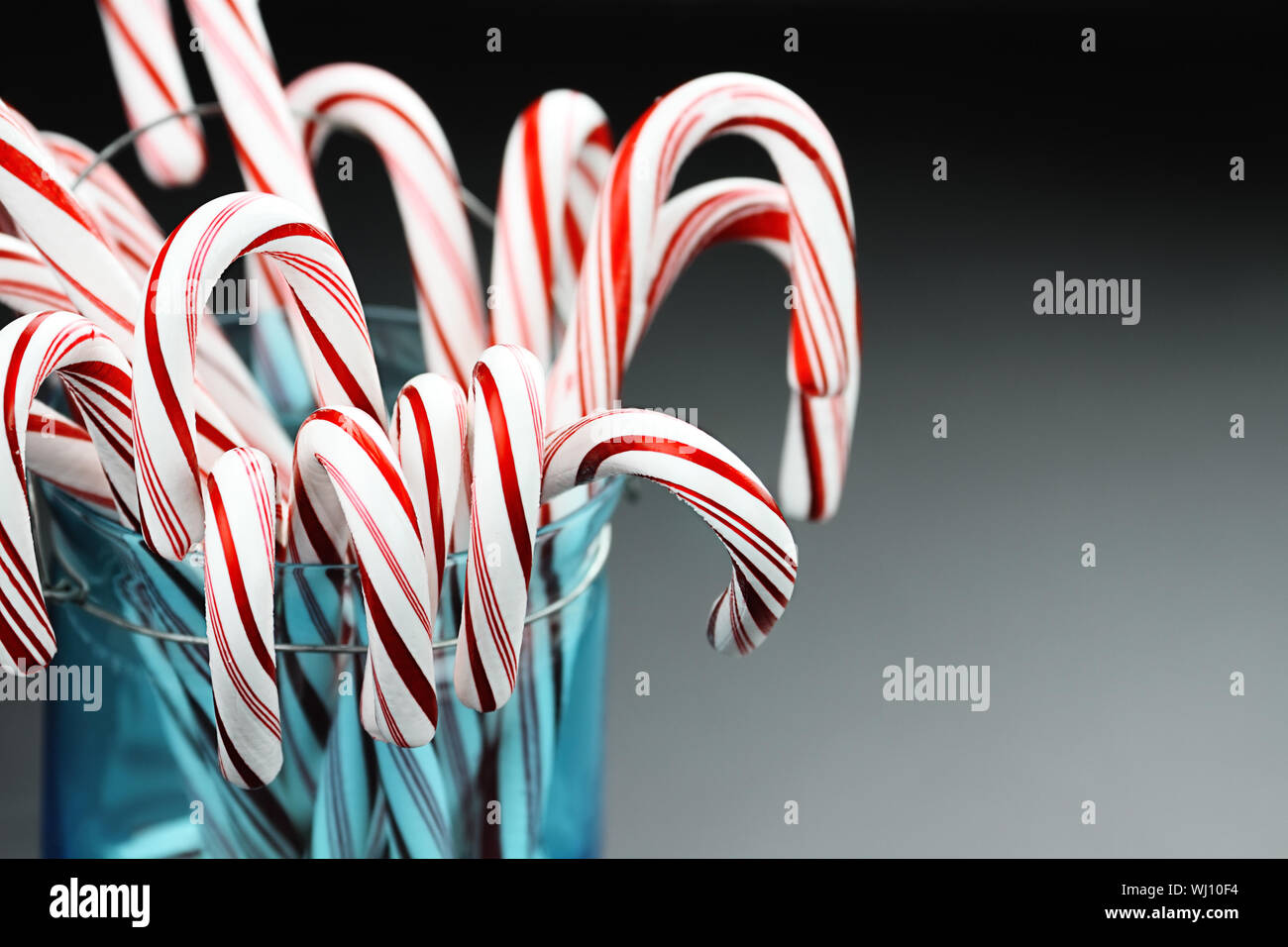 Jar of candy canes against a grey background with copy space Stock ...