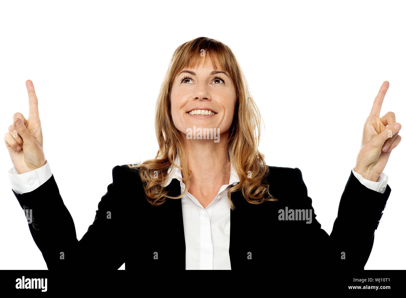 Smiling corporate lady pointing upwards Stock Photo - Alamy