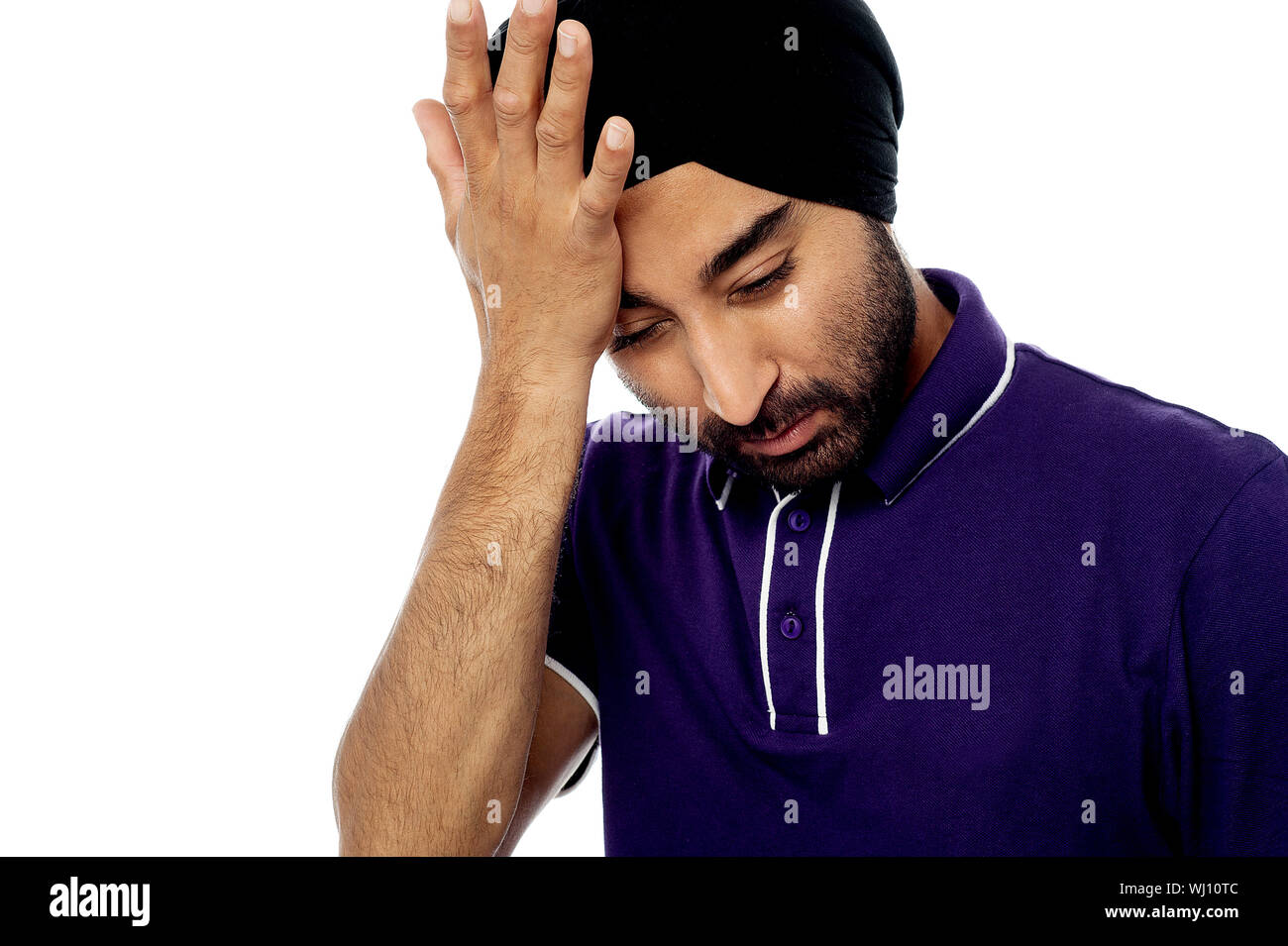 Man suffering from headache, wincing Stock Photo - Alamy