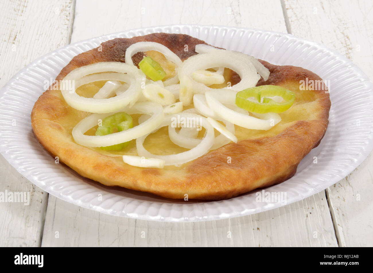 Langos, home made Hungarian fast food on a paper plate Stock Photo - Alamy