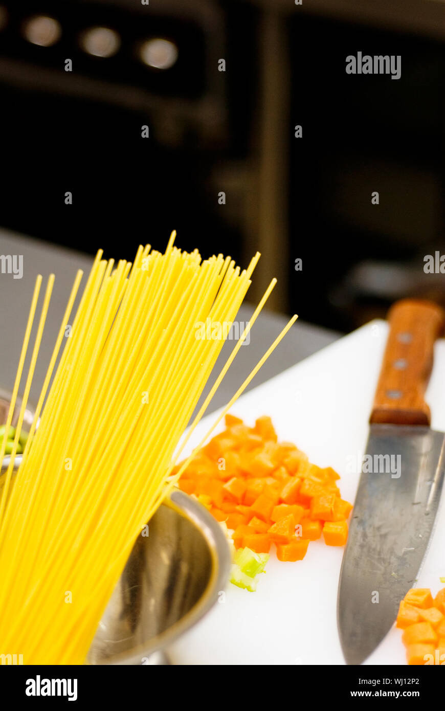 italian spaghetti pasta on a typical full equipped restaurant kitchen ...