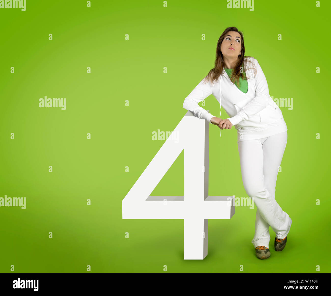 Woman contemplating questions with 3D forms on a green background Stock ...