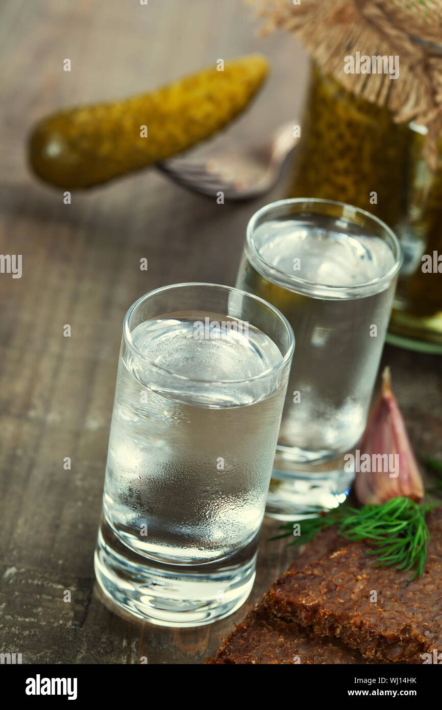 Russian vodka with traditional black bread and pickles Stock Photo - Alamy