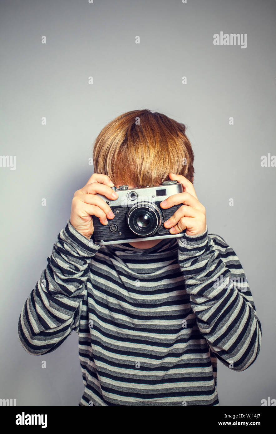 handsome boy with an old camera Stock Photo - Alamy