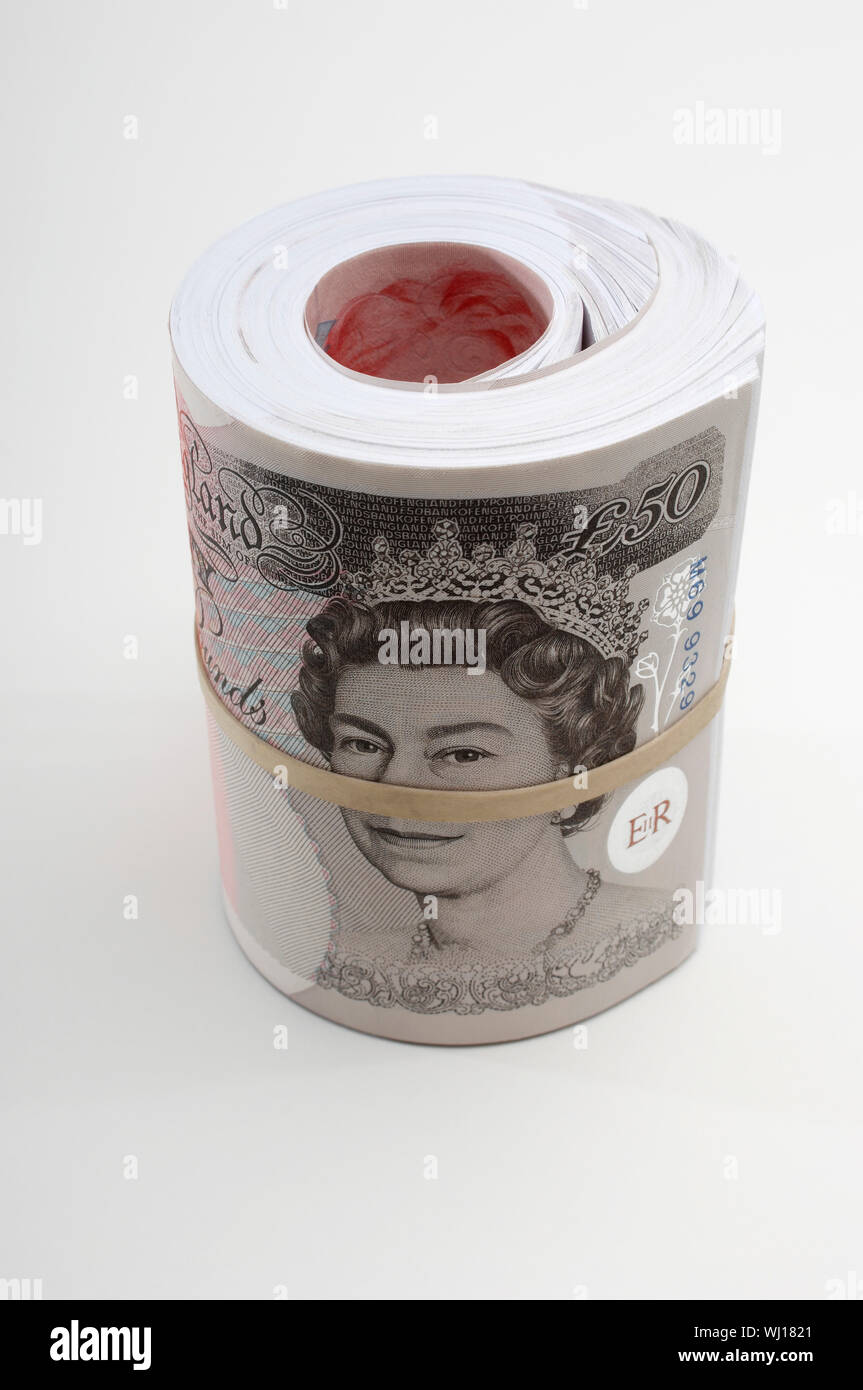Roll of British paper currency Stock Photo - Alamy
