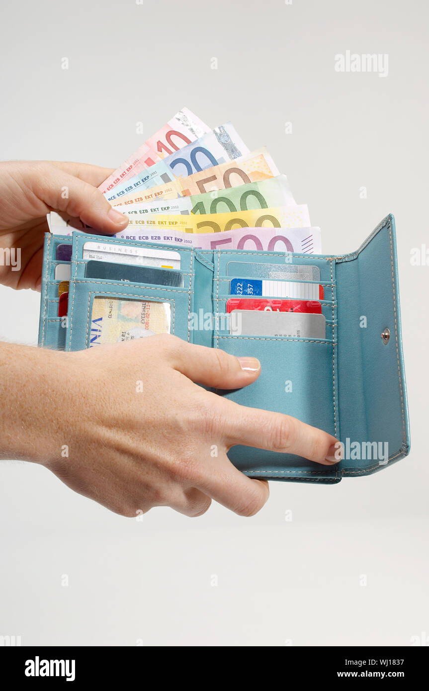 Wallet Full of Money Stock Photo - Alamy