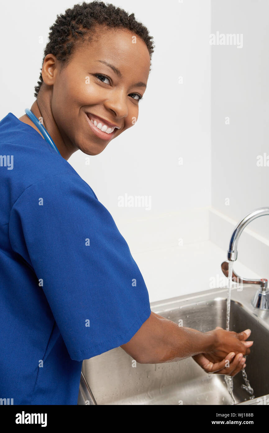 Female nurse washing hands in hospital,portrait Stock Photo - Alamy