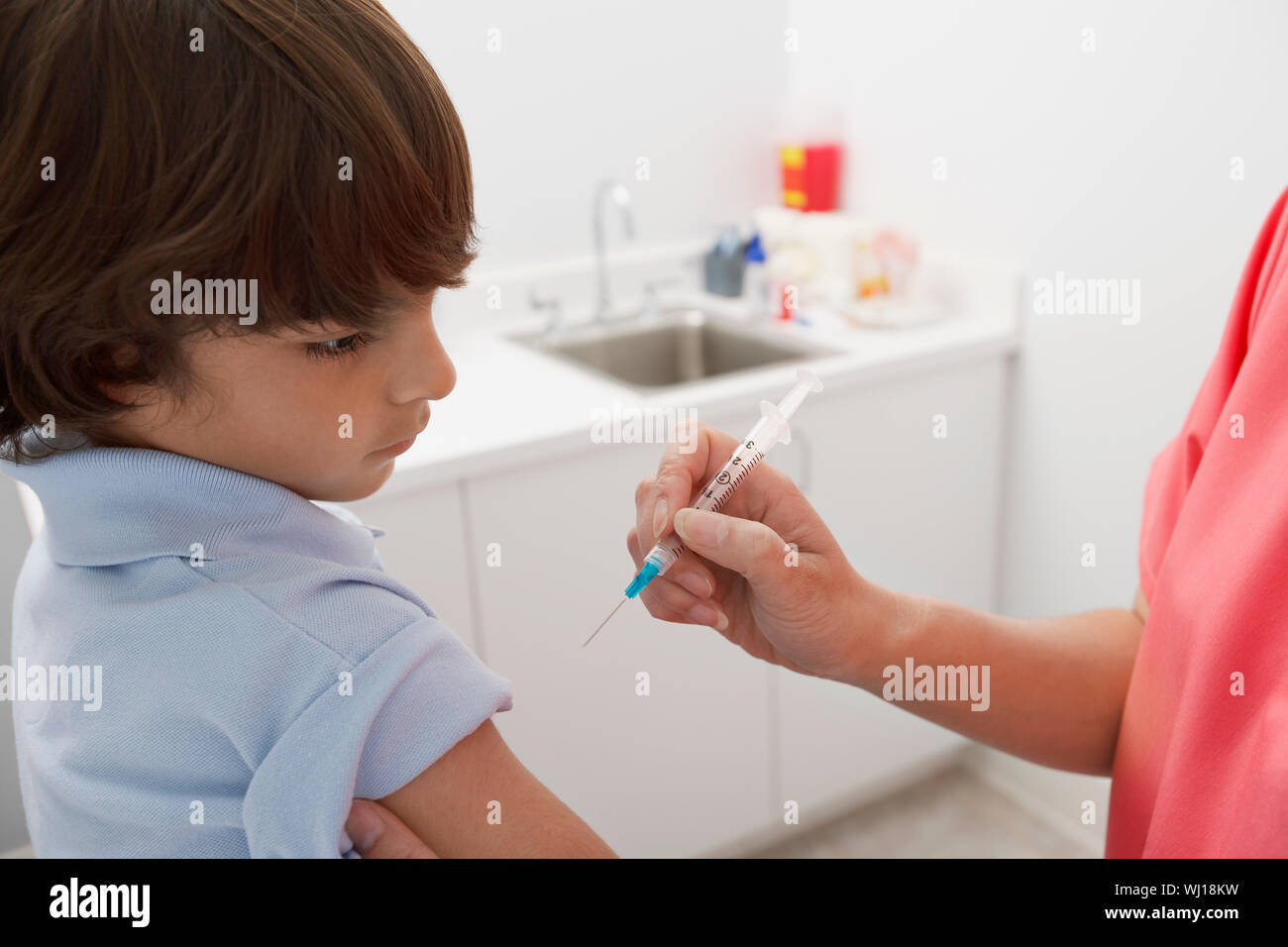 Boy receiving injection Stock Photo - Alamy