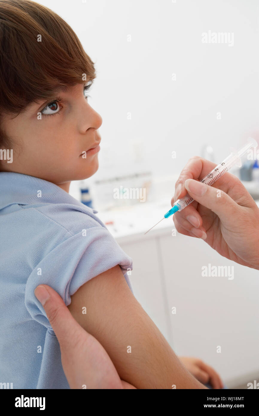 Boy receiving injection Stock Photo - Alamy