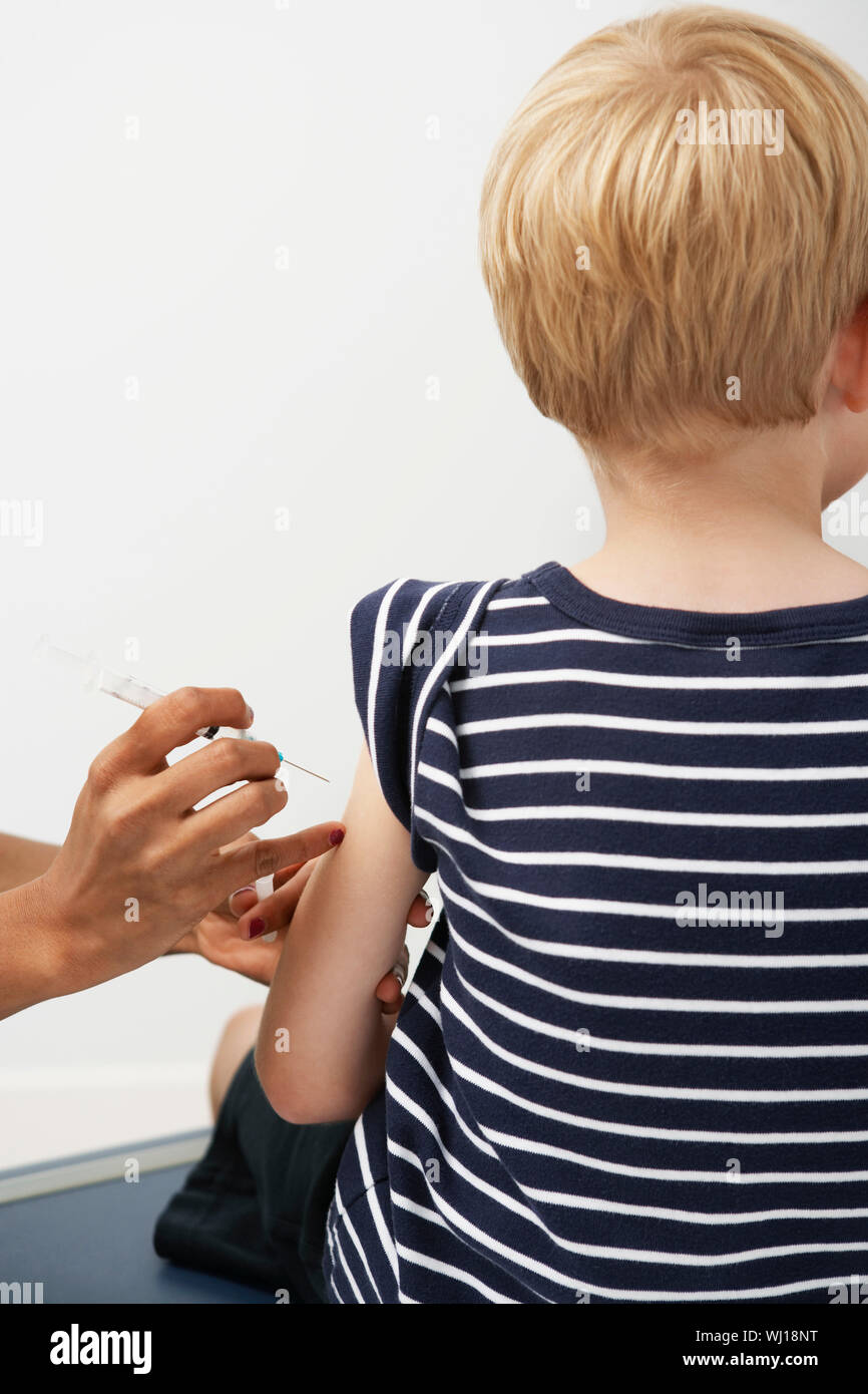 Boy receiving injection Stock Photo - Alamy