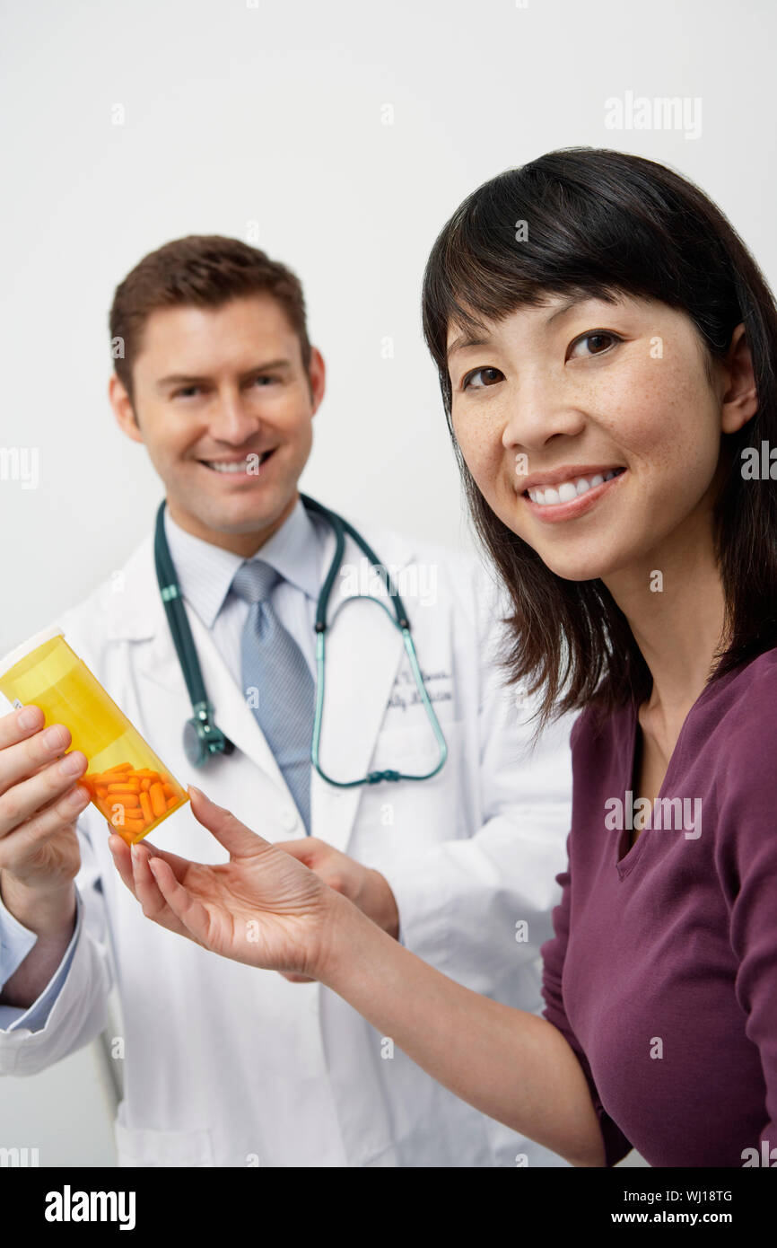 Doctor giving female patient medication in hospital Stock Photo - Alamy