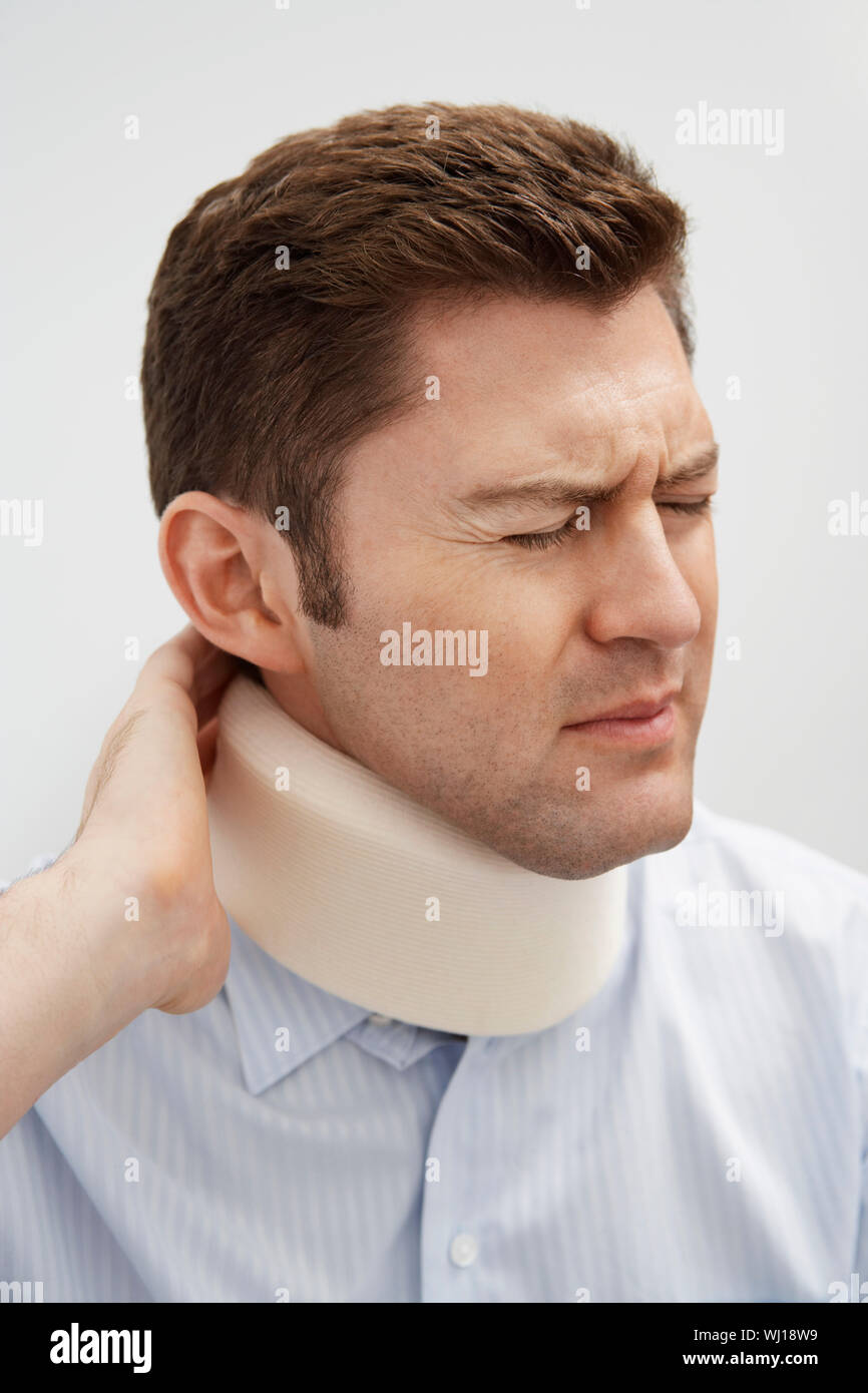 Man wearing neck brace in hospital Stock Photo - Alamy