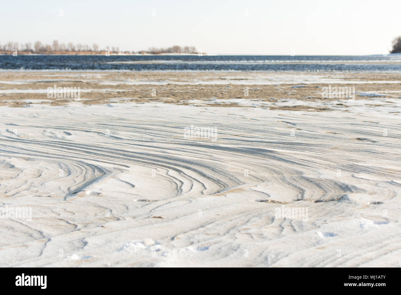 Snowy winter beach and sea. Winter weather. Snowy waves Stock Photo - Alamy