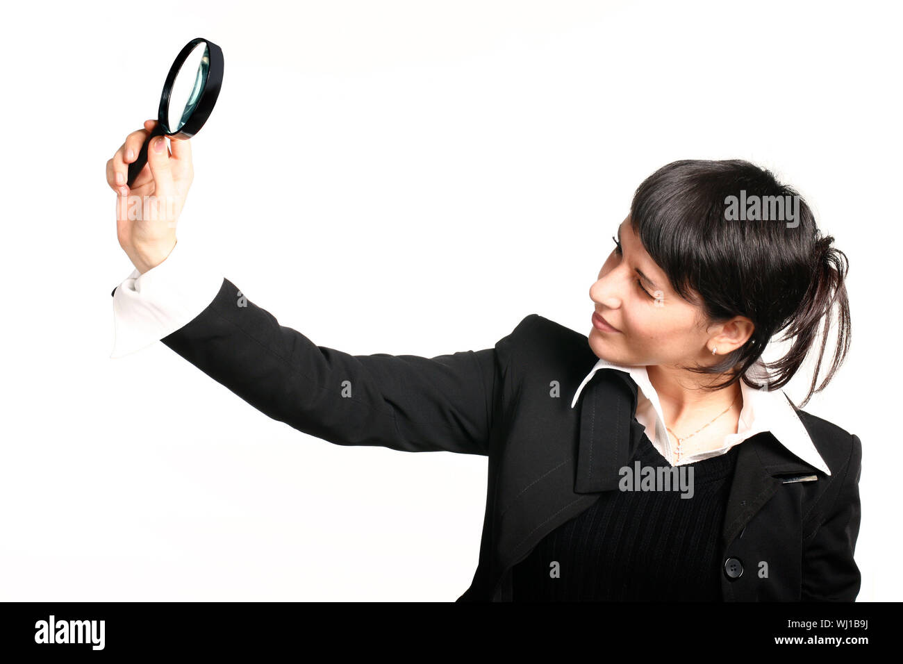 The business girl searches for something through a magnifier Stock ...
