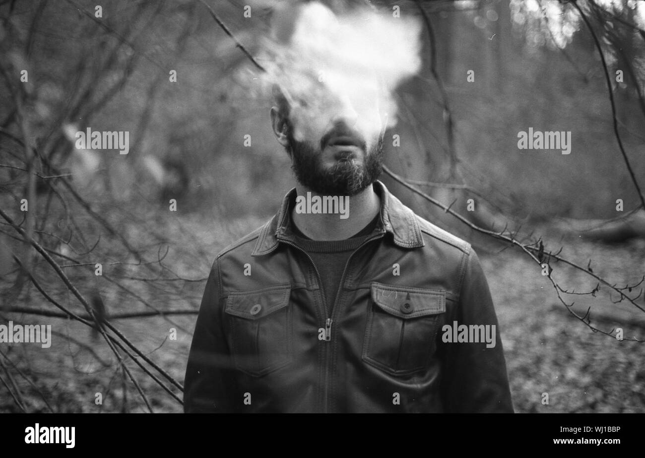 Man exhaling smoke hi-res stock photography and images - Alamy