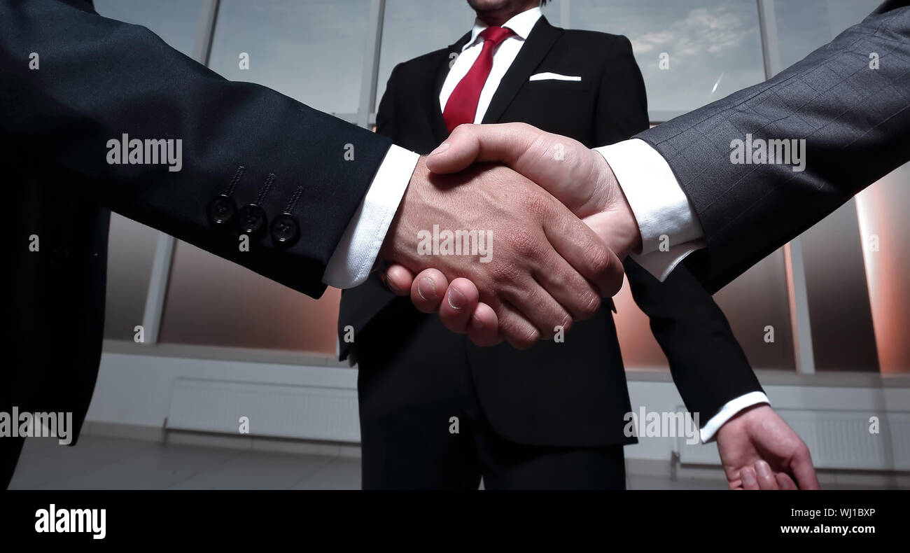 Three business shake hands hi-res stock photography and images - Alamy