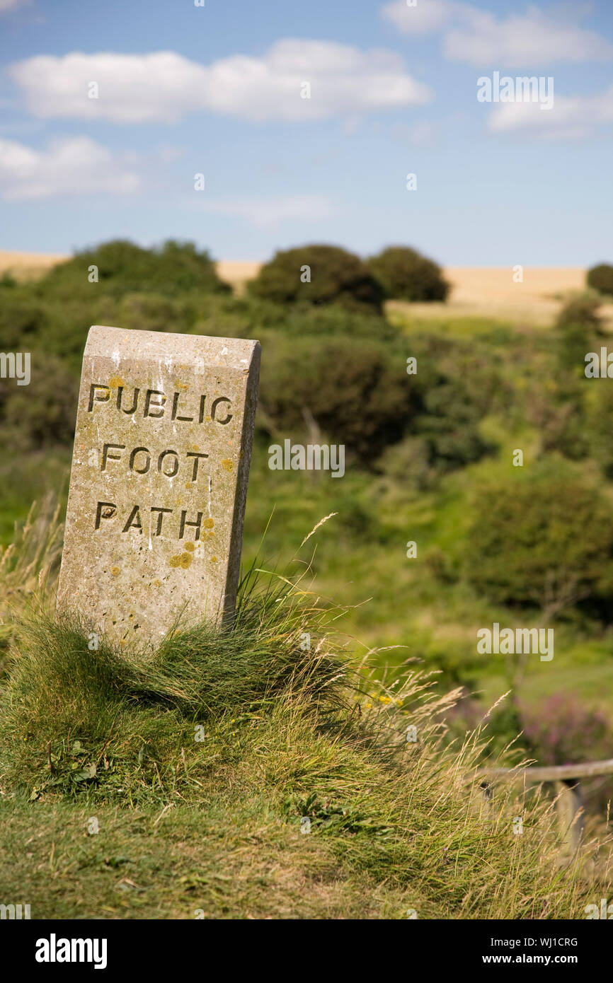 Stone sign marking footpath Stock Photo - Alamy