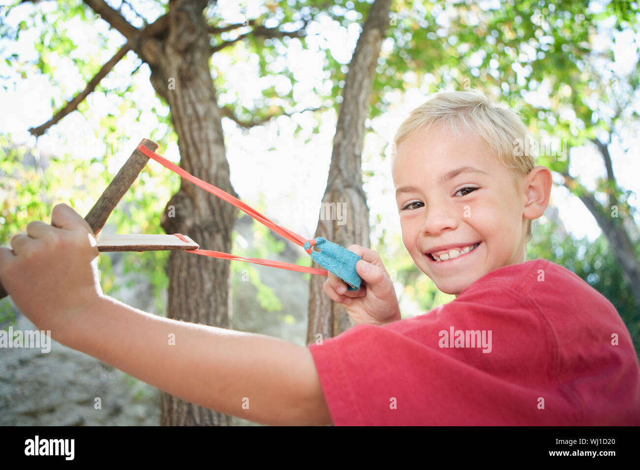 Boy with catapult hi-res stock photography and images - Alamy