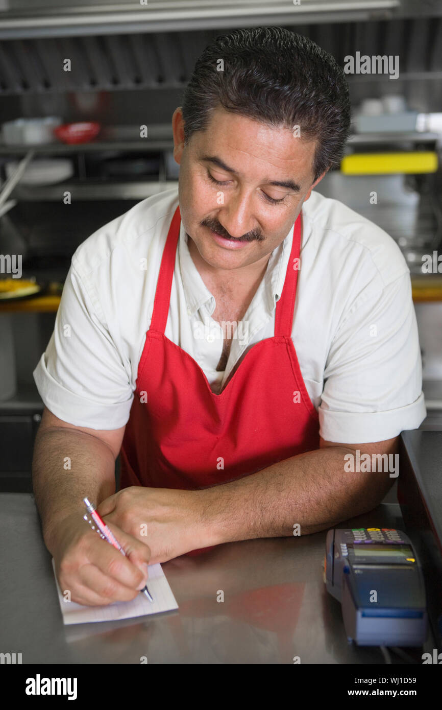 Black waiter writing counter hi-res stock photography and images - Alamy