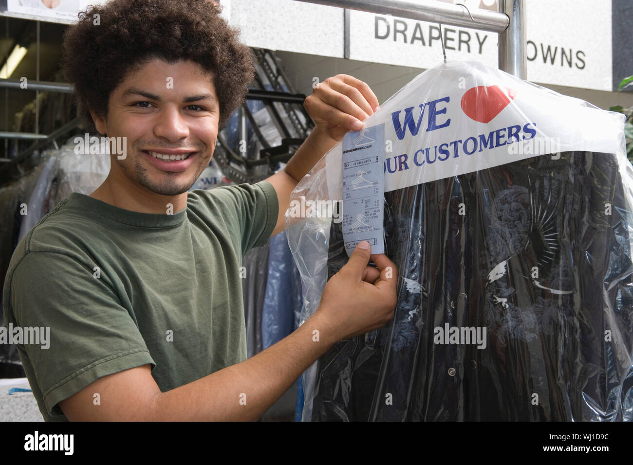 Man in dry cleaners hi-res stock photography and images - Alamy