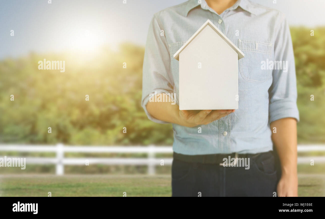 Residential Structure house human in hand Stock Photo - Alamy