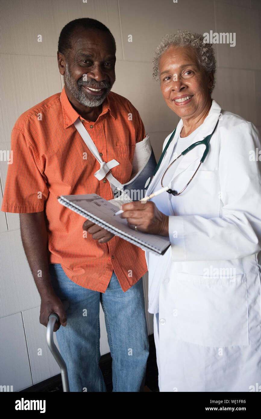 Doctor with patient Stock Photo - Alamy