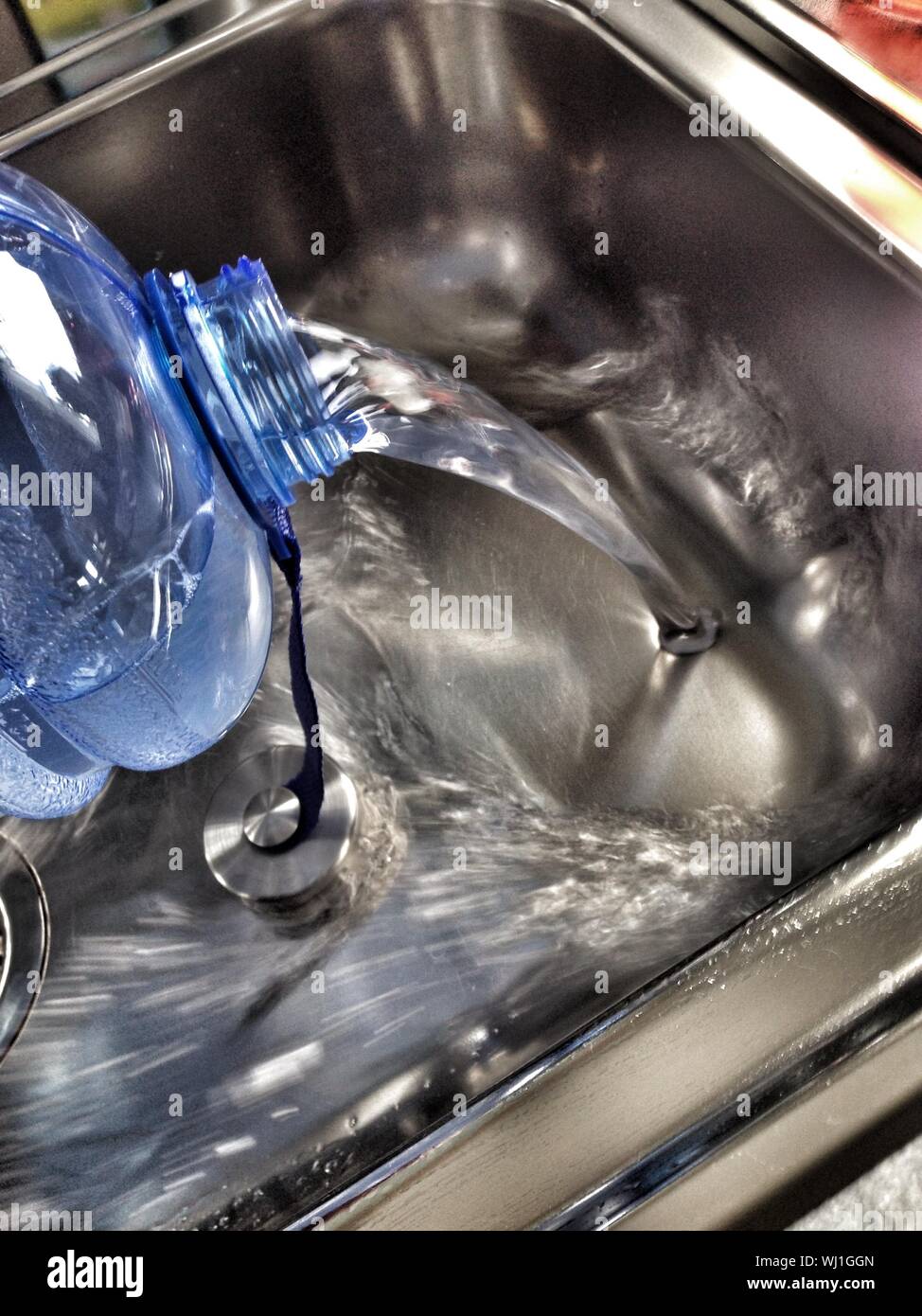 Pouring into sink hi-res stock photography and images - Alamy