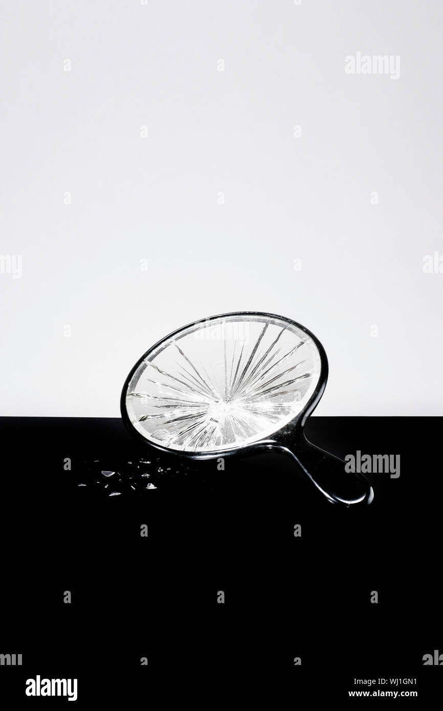 Broken magnifying glass Stock Photo - Alamy