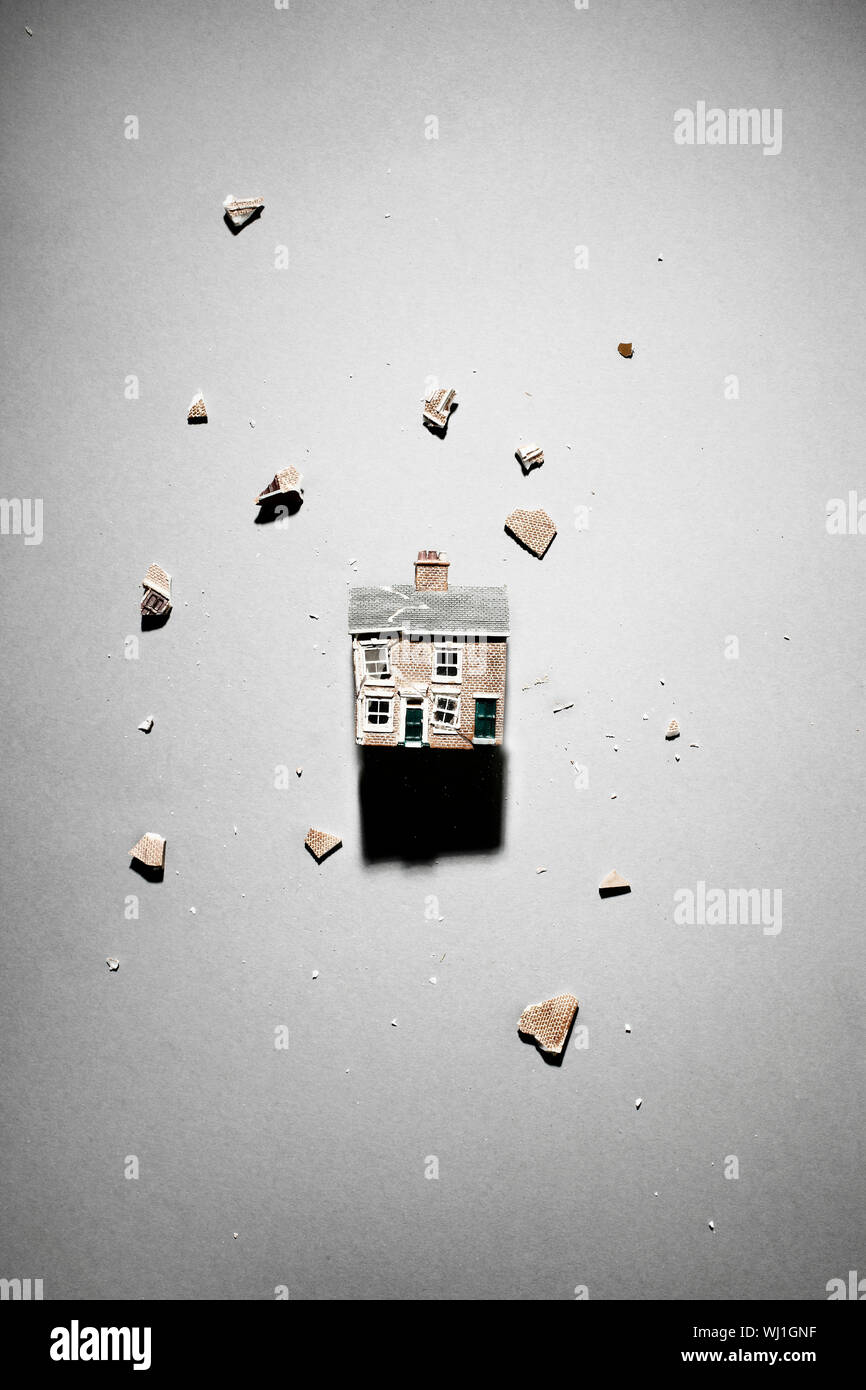 Smashed model house Stock Photo - Alamy