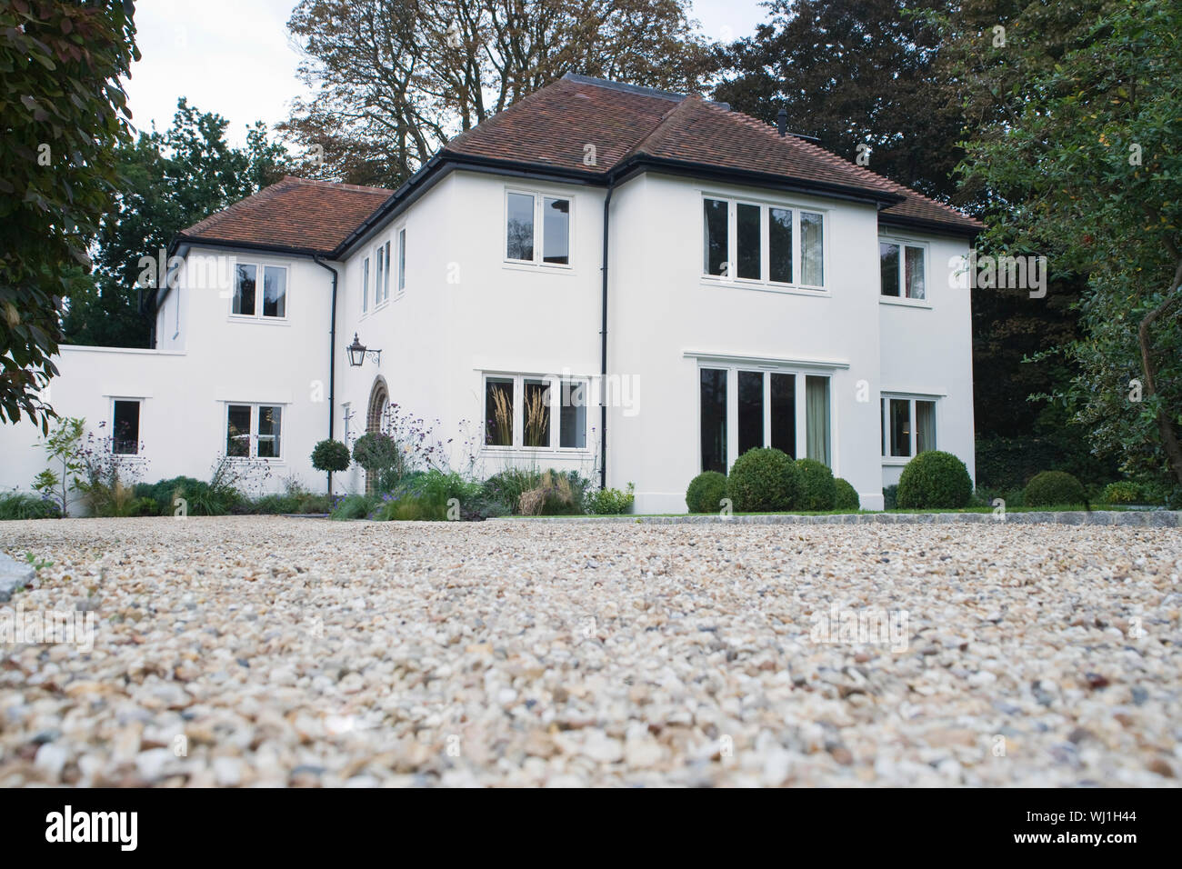 House exterior with surrounding yard and driveway Stock Photo - Alamy