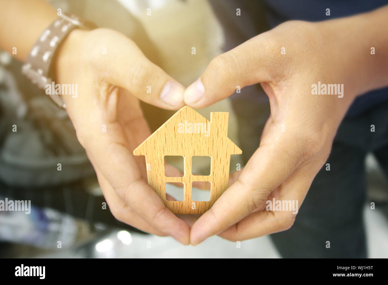 Mortgage concept by house from in a hand Stock Photo - Alamy