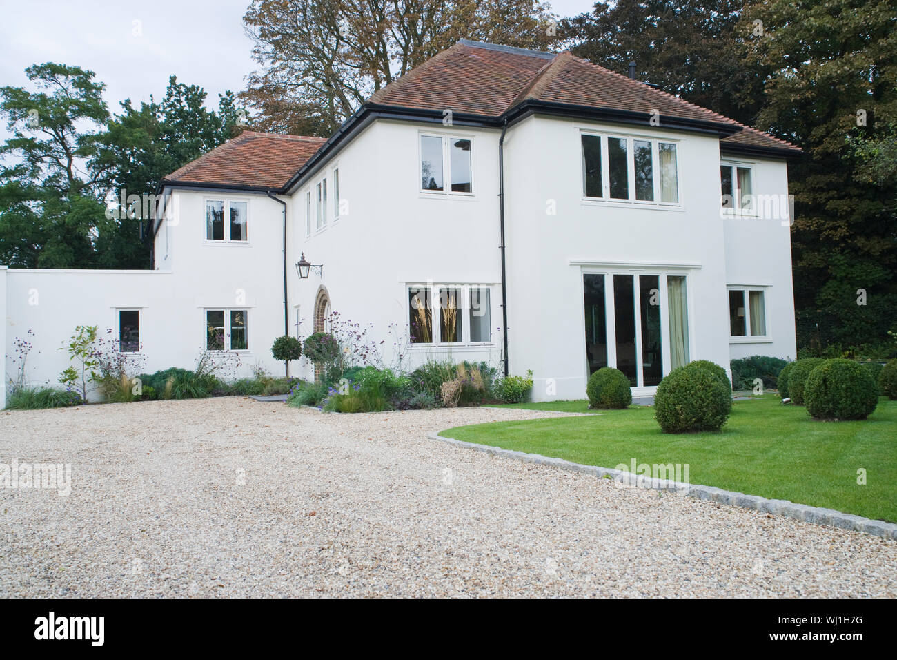 House exterior with surrounding yard and driveway Stock Photo - Alamy