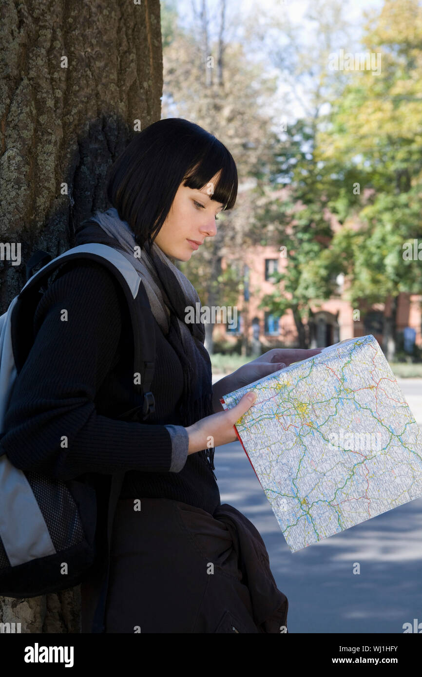 Young explorer reading map hi-res stock photography and images - Alamy