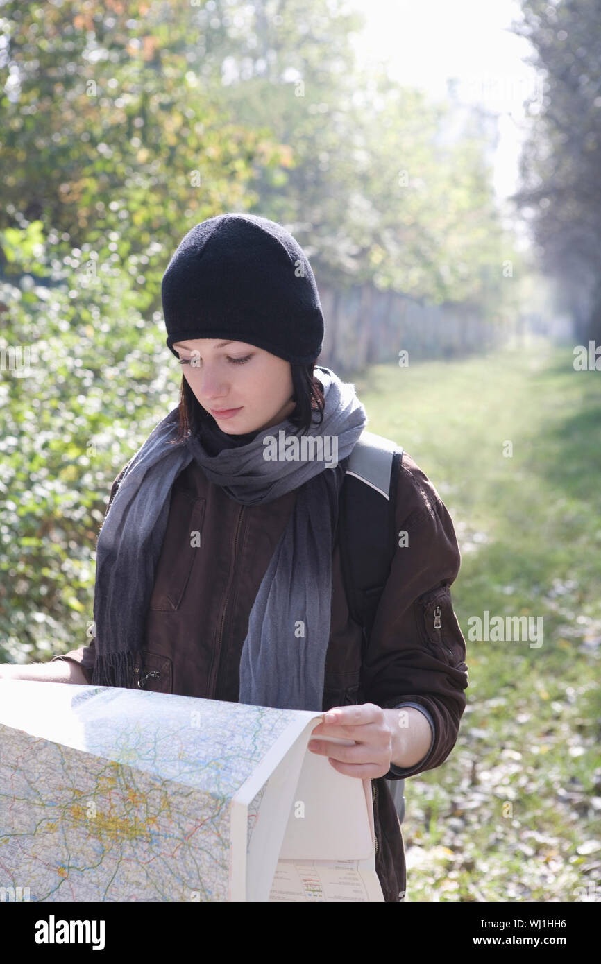 Young explorer reading map hi-res stock photography and images - Alamy