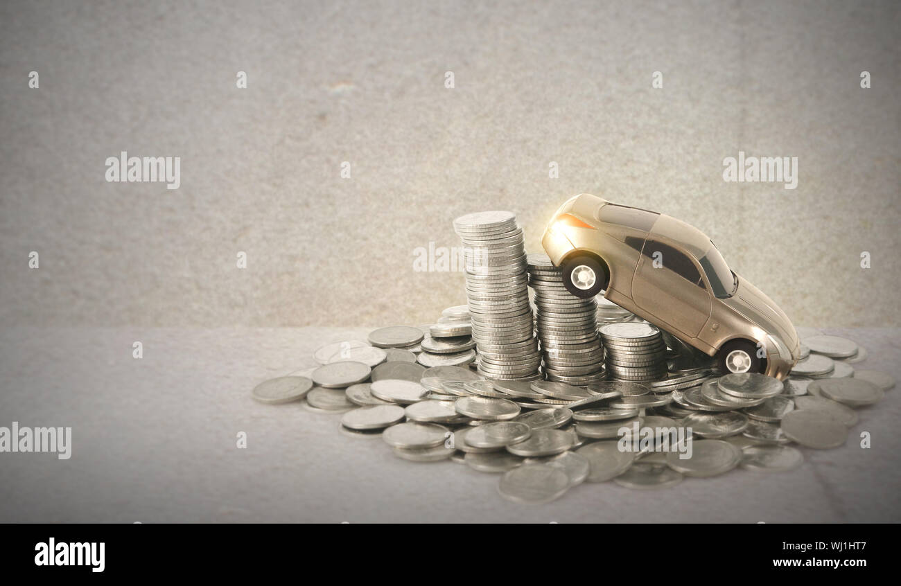 Car Model Over a Stacked Coin Stock Photo - Alamy