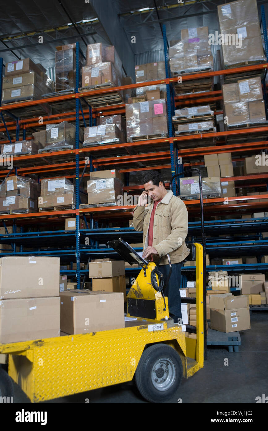 Man working in distribution warehouse Stock Photo - Alamy