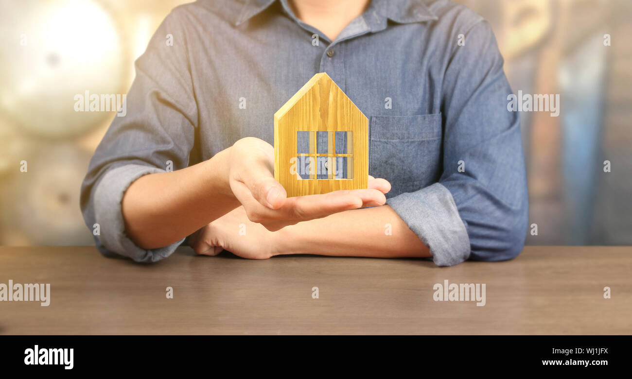 Hands holding house homeless housing shelter and real estate , family ...