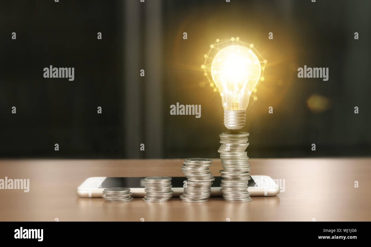 Light bulb on coins hi-res stock photography and images - Alamy