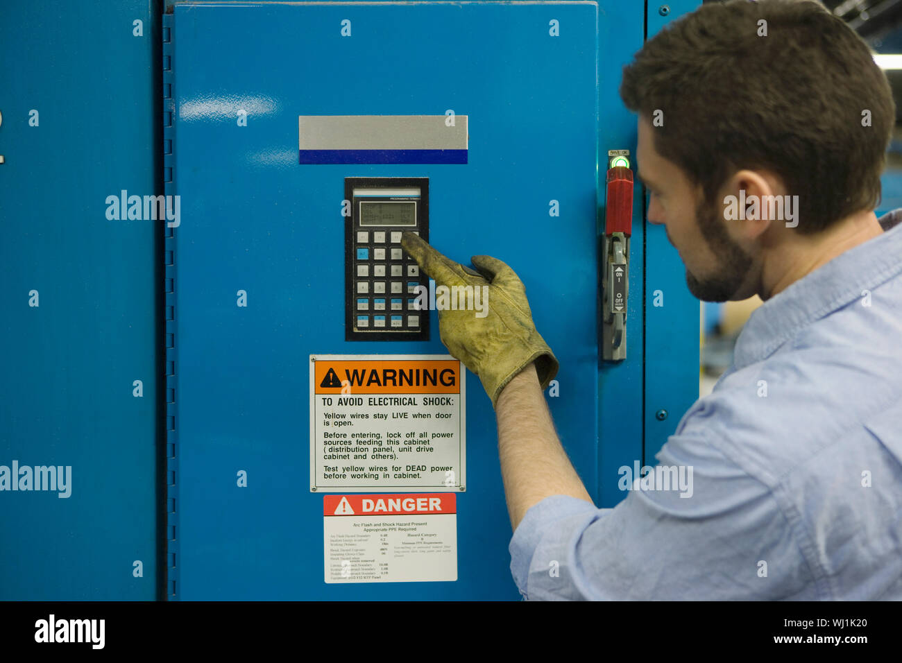 Man pressing button rear view hi-res stock photography and images - Alamy