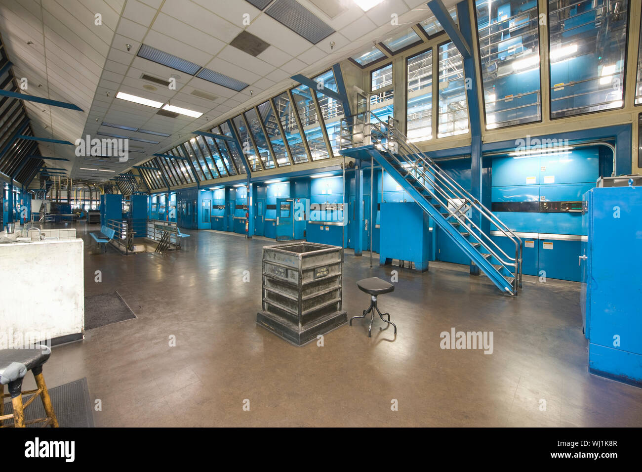 Interior view of a spacious newspaper factory Stock Photo - Alamy
