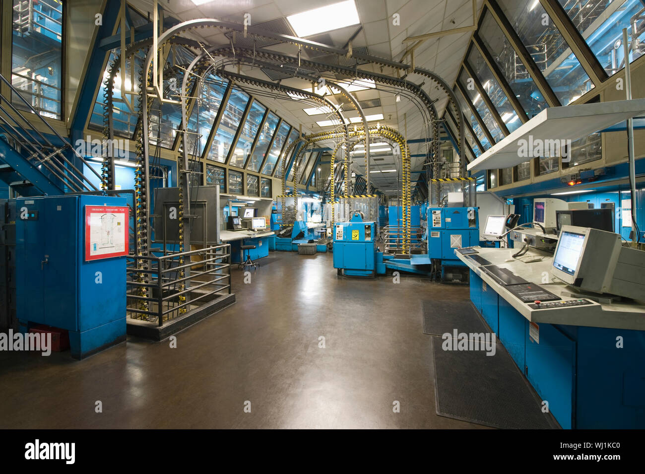 Interior view of a spacious newspaper factory Stock Photo - Alamy