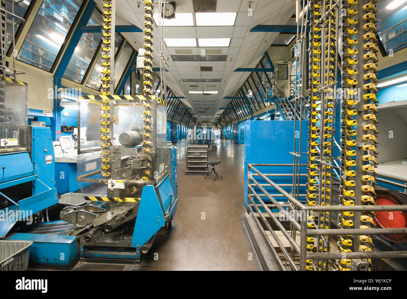 Interior view of a spacious newspaper factory Stock Photo - Alamy