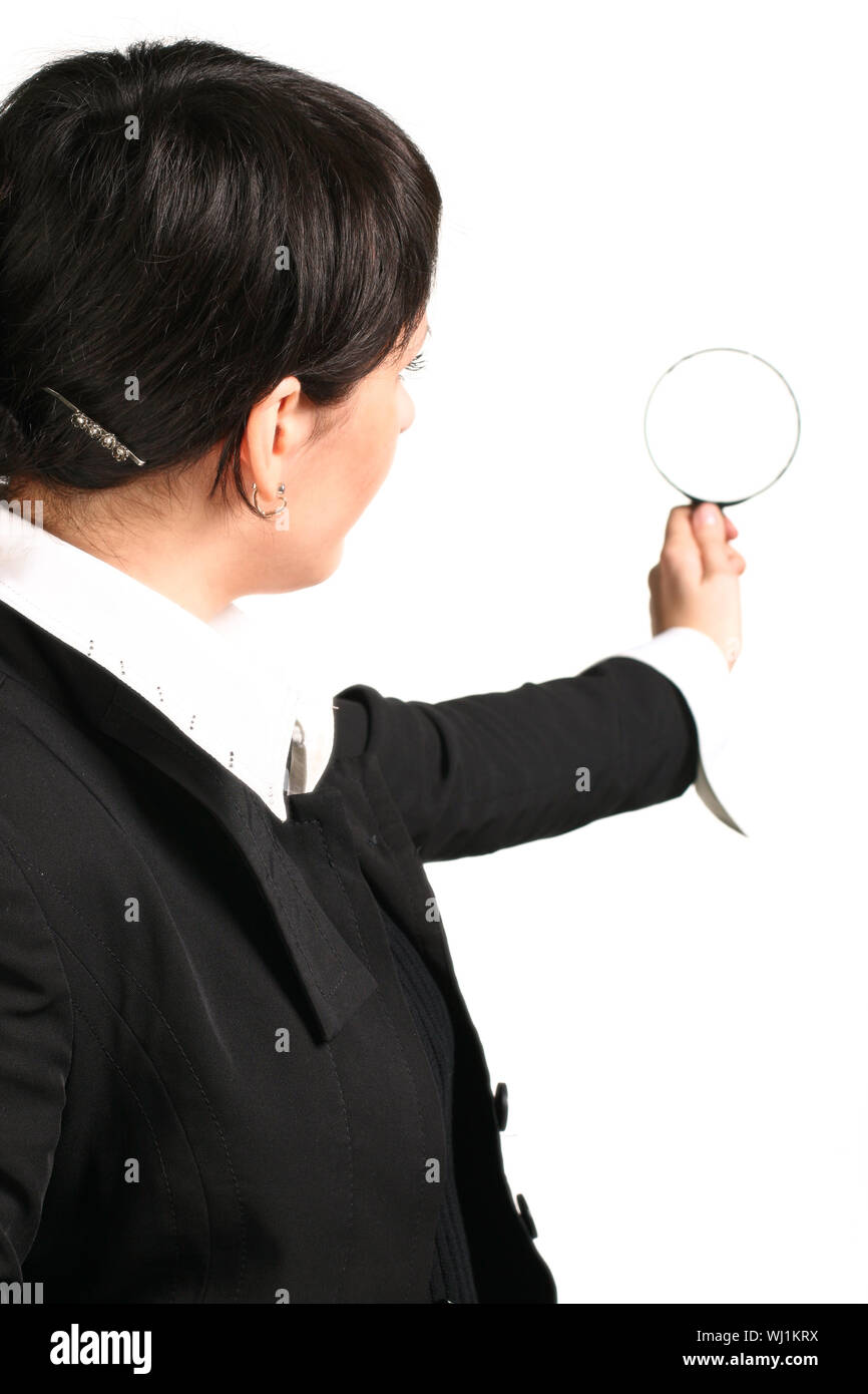 The business girl searches for something through a magnifier Stock ...