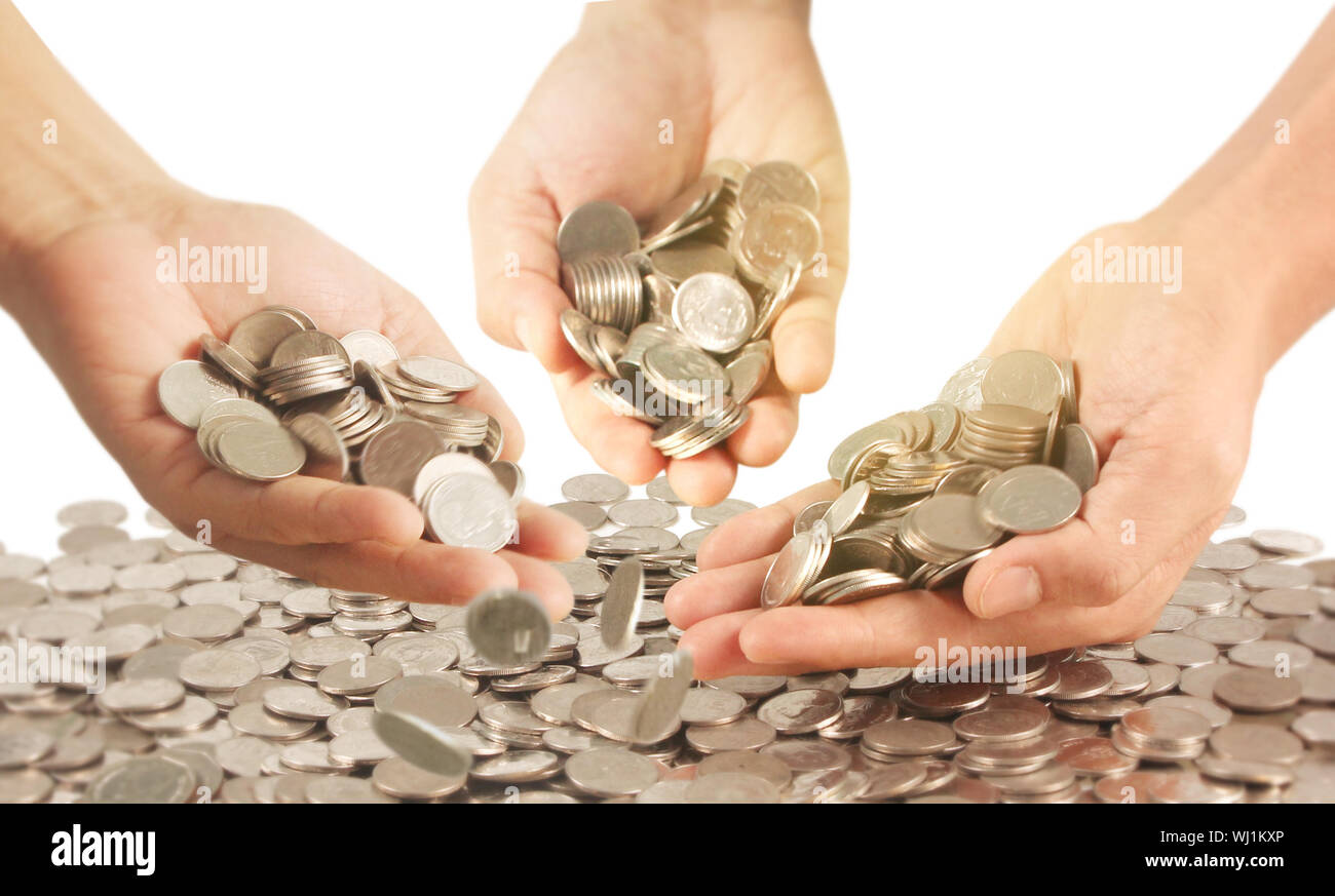 Coins placed on top. While a men's hand pouring coins Stock Photo - Alamy