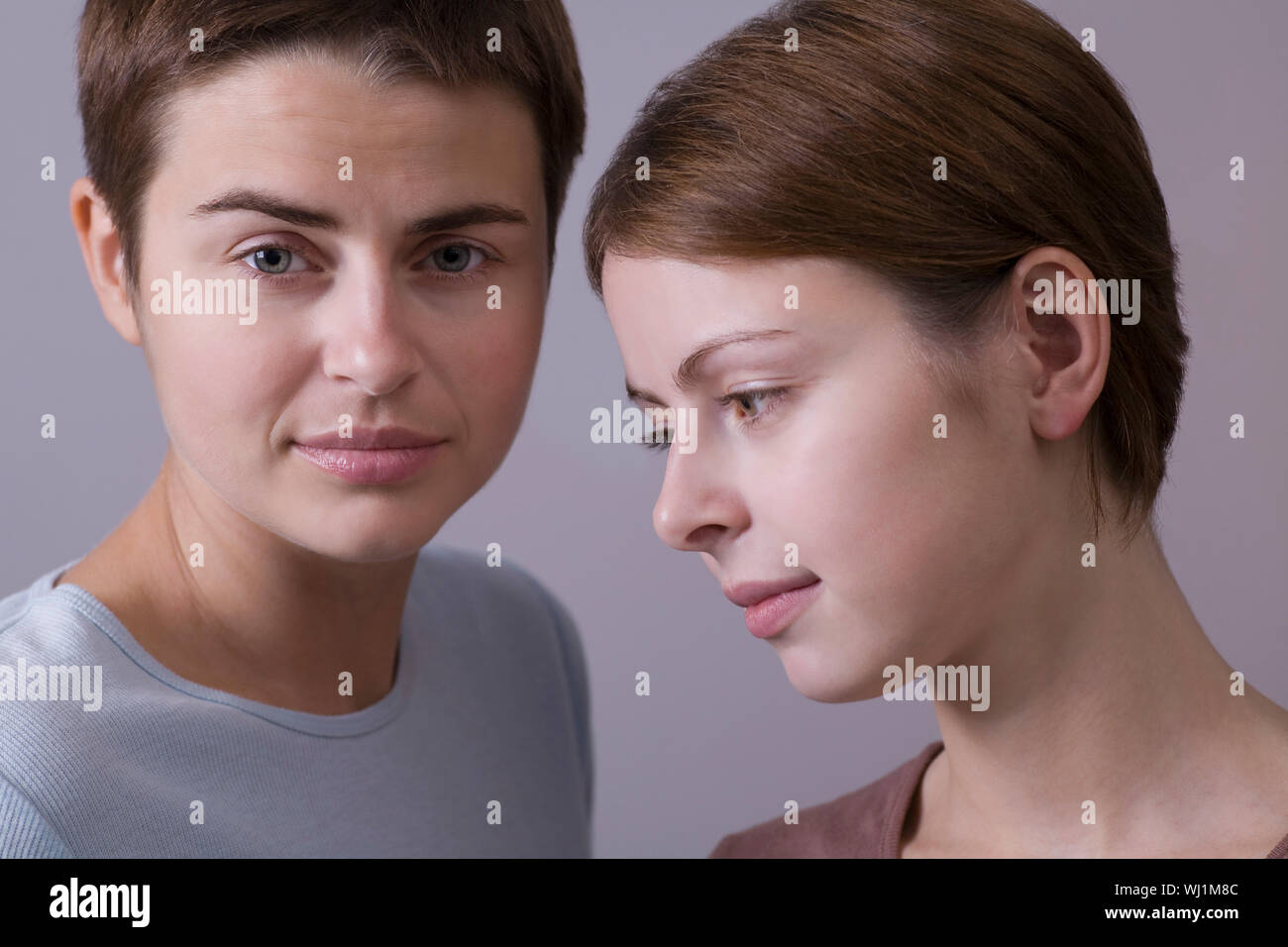 Adult sisters serious hi-res stock photography and images - Alamy