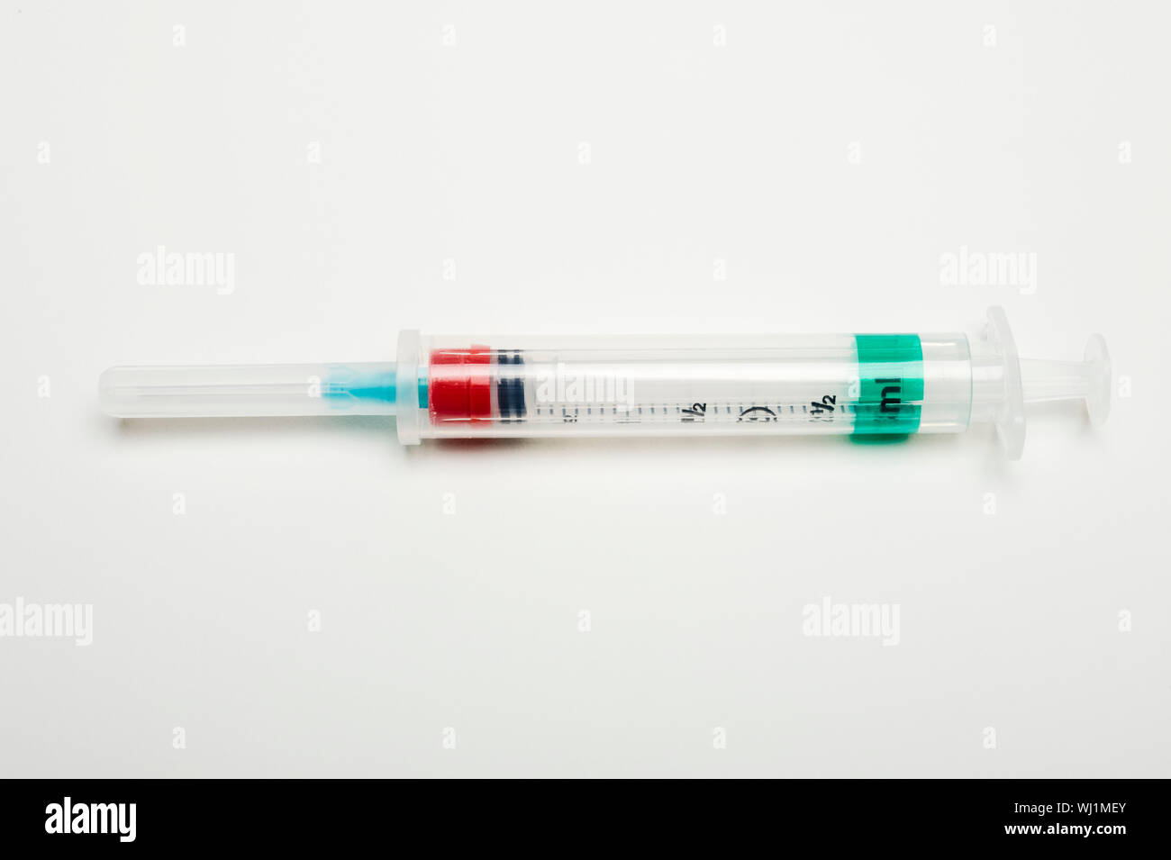 Medical injection isolated over white background Stock Photo - Alamy