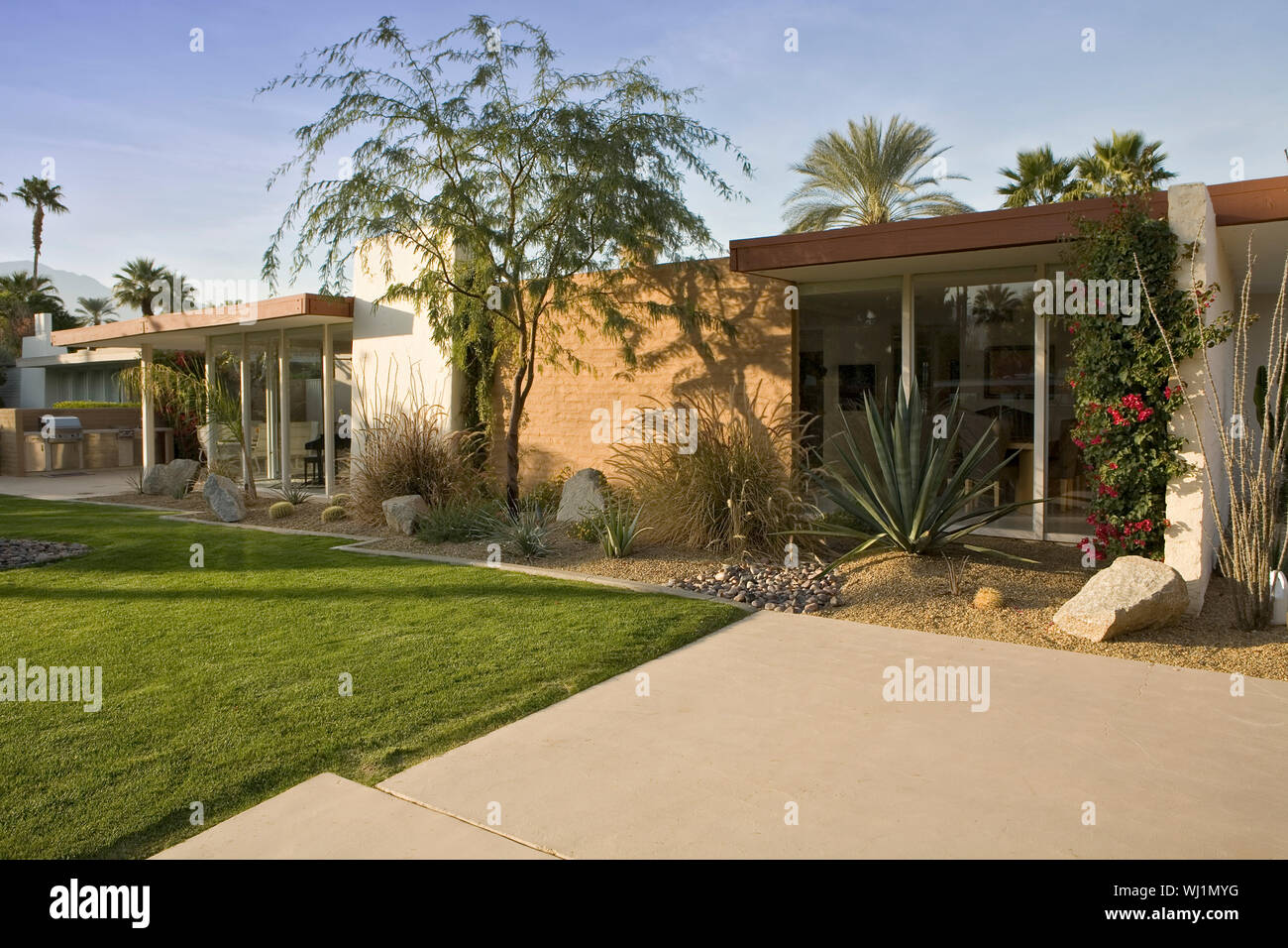 View of modern house exterior with lawn in foreground Stock Photo - Alamy