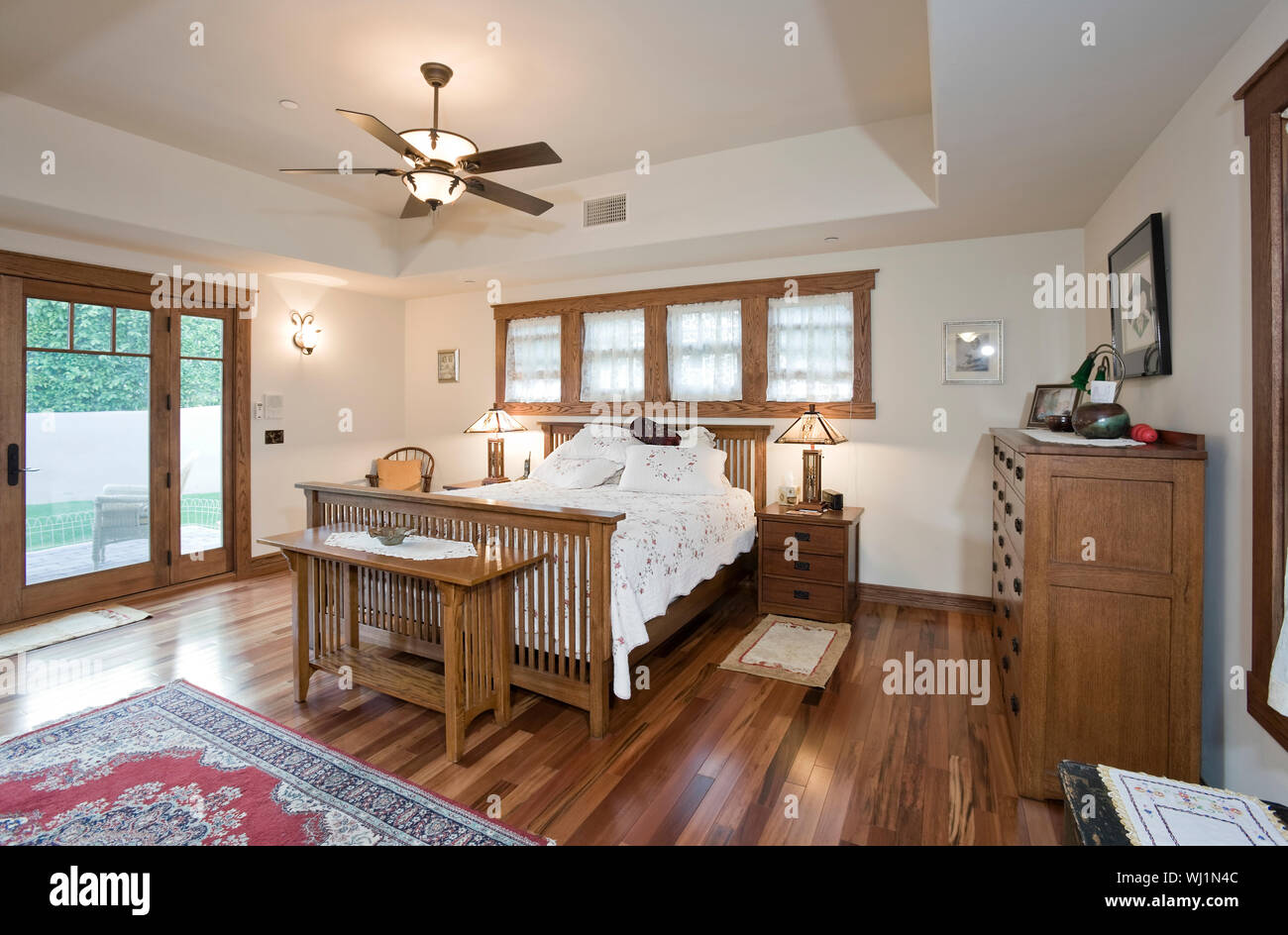 Neat and tidy bed of modern apartment bedroom hi-res stock photography ...