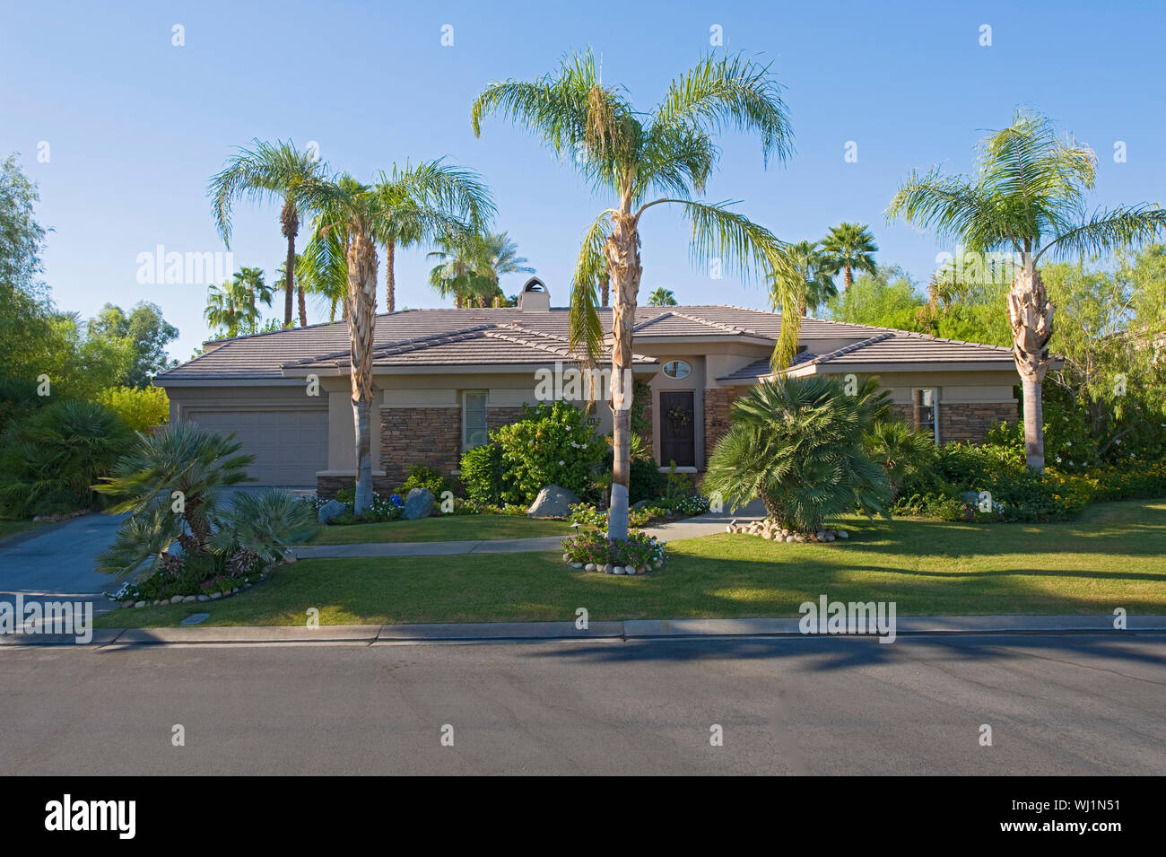View of a modern suburban house exterior with road in foreground Stock ...